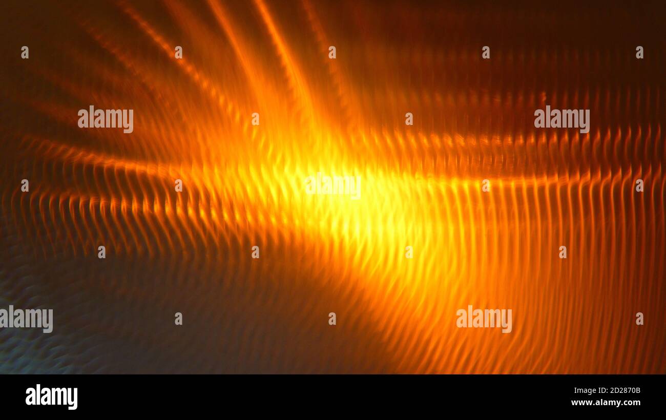 Vibrant golden light sources with glass texture for background or ...