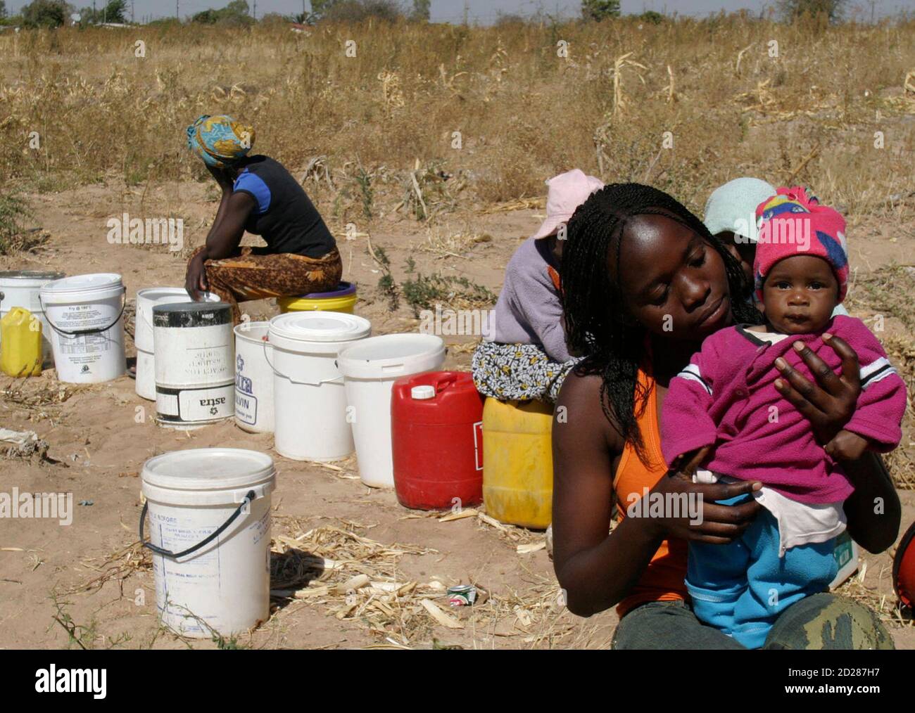 Woman water fetch bucket hi-res stock photography and images - Alamy