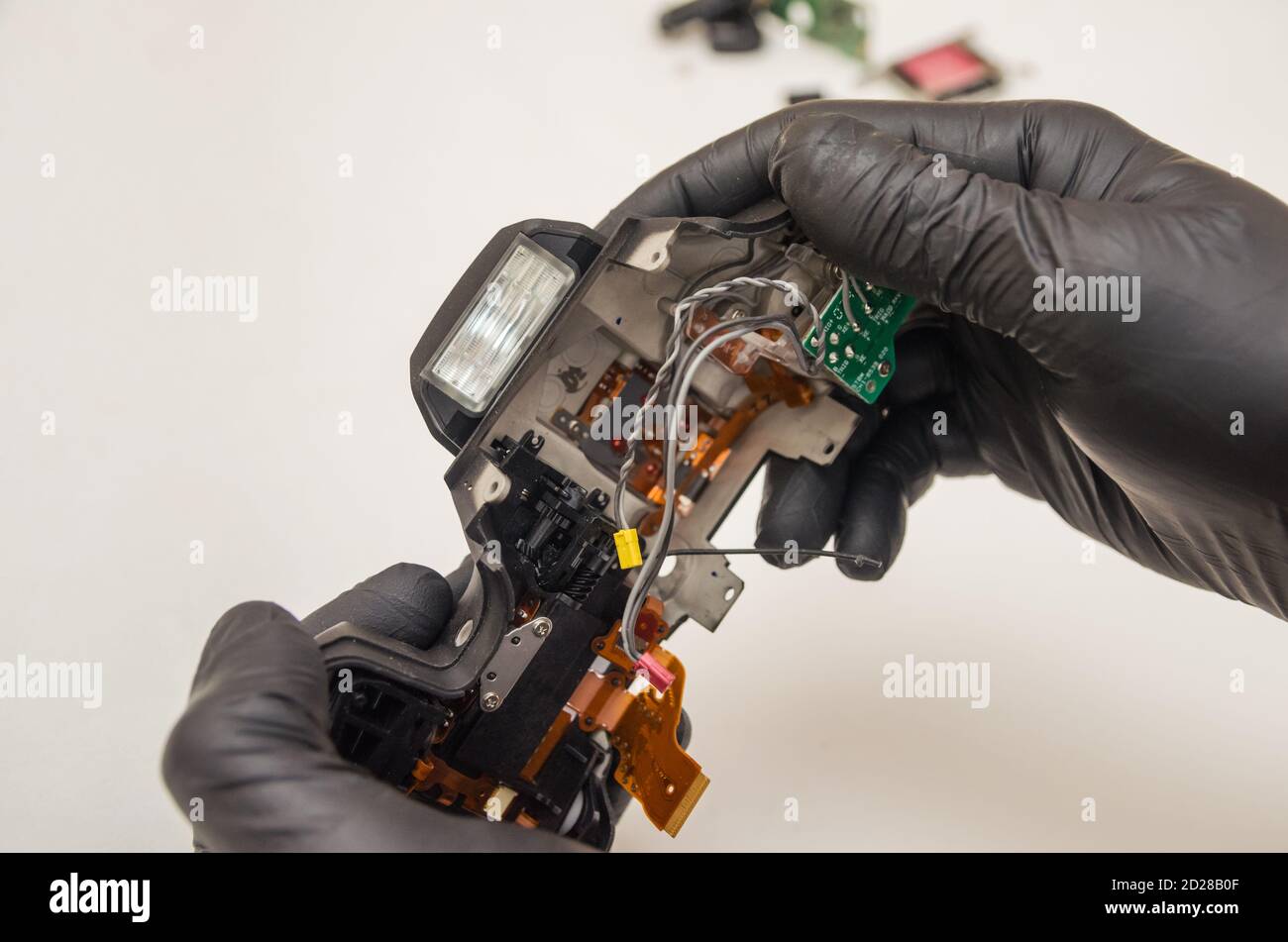 Disassembled camera body in the hands of the master Stock Photo - Alamy