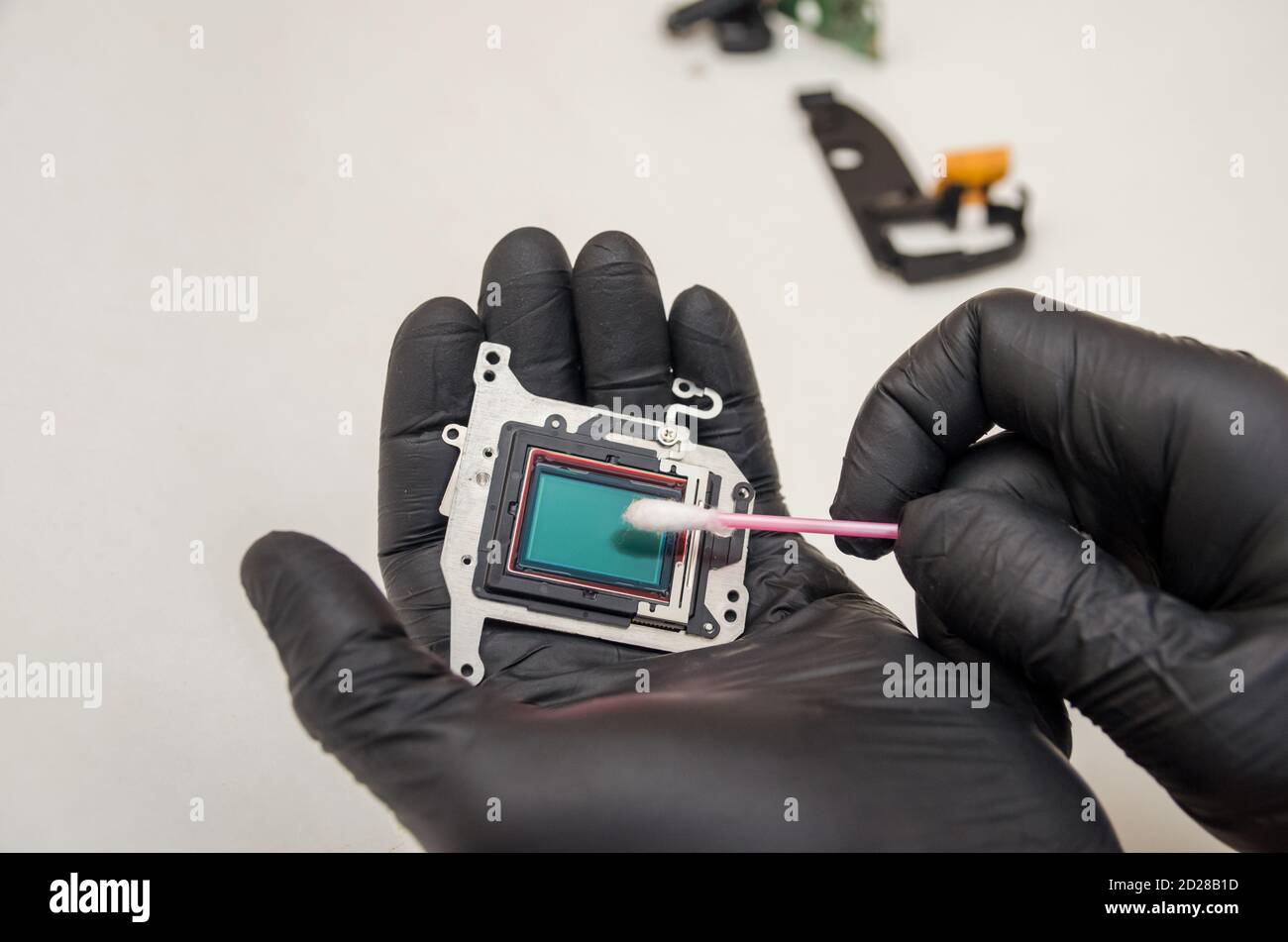 Repair matrix camera. The matrix is in the hands of a master Stock ...