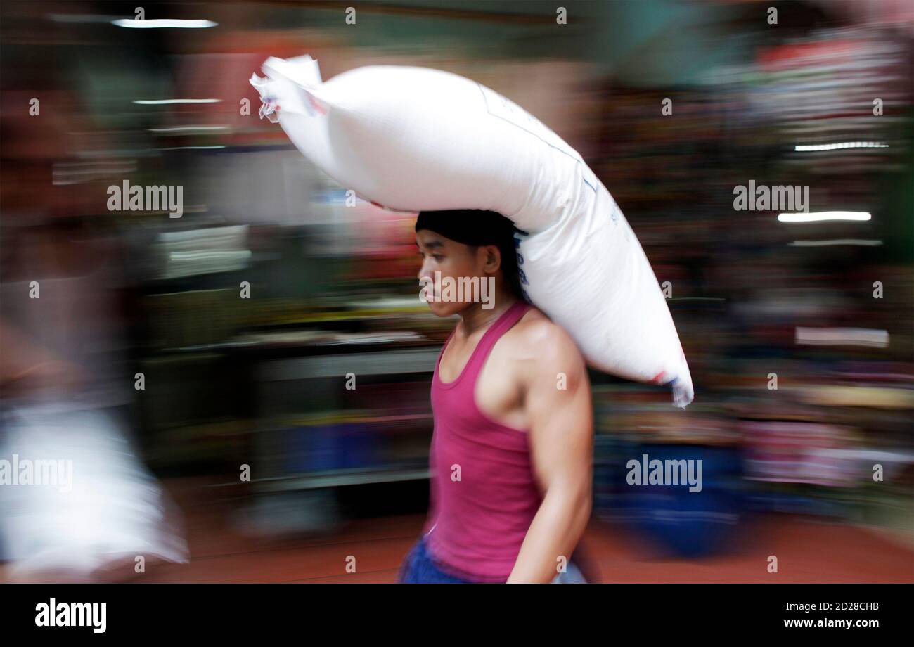 Man carrying a rice bag High Resolution Stock Photography and Images ...