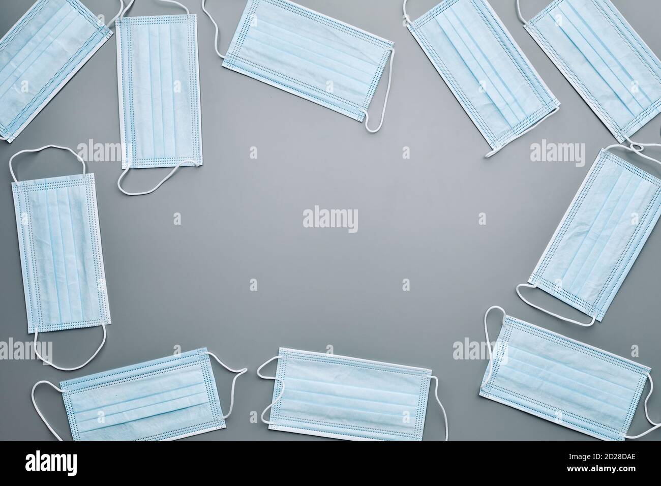 Top view background composition of medical masks framing blank space in ...