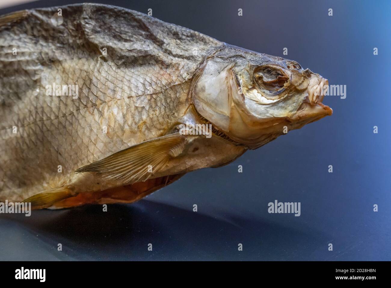 Head of dried bream on a black background. Fish dried bream. Beer Snack ...