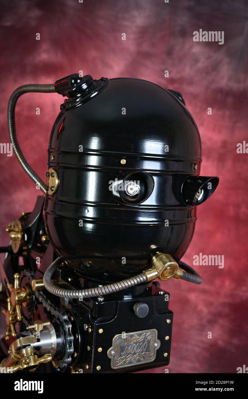 Steampunk robot head on red background Stock Photo - Alamy