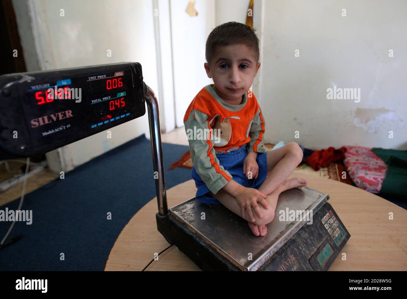 Boy weighing scale weight hi-res stock photography and images - Alamy