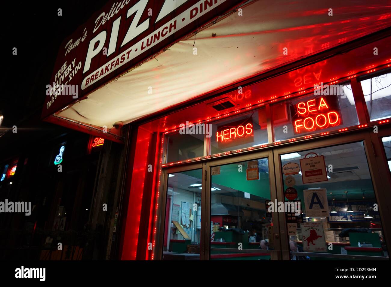 pizza store front neon sign Stock Photo - Alamy
