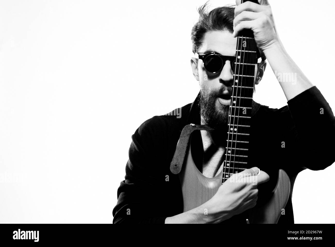 man with guitar in hands musician rock star performance lifestyle light ...