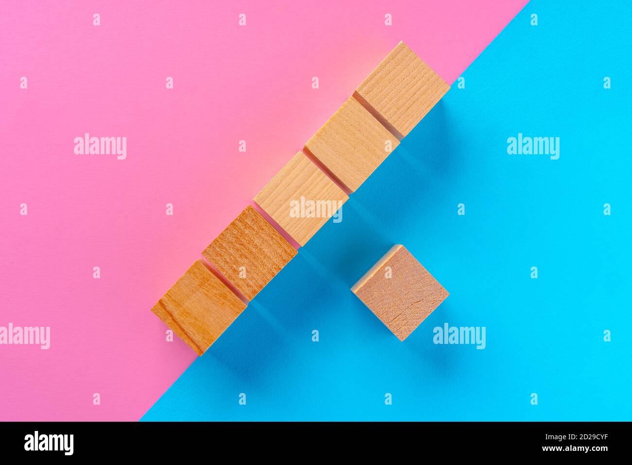 Top view photo of wooden blocks on pink and blue Stock Photo - Alamy