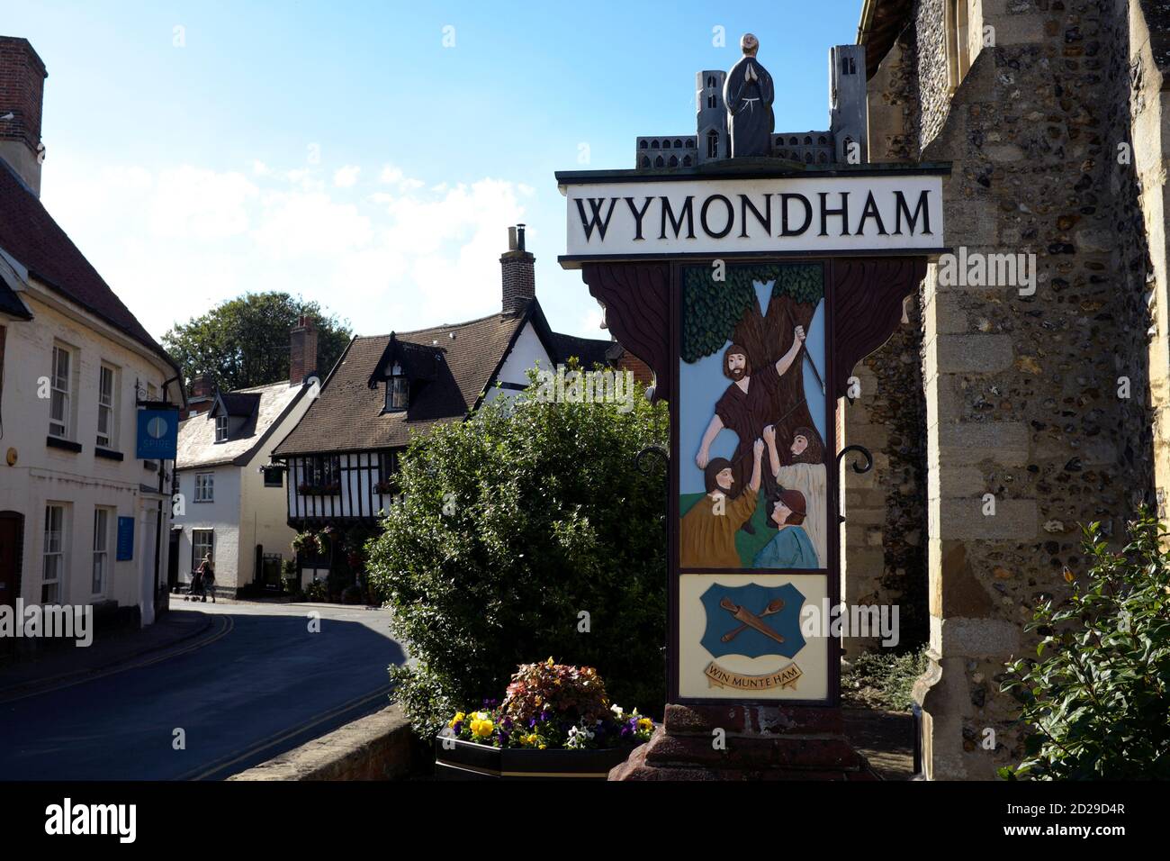 Wymondham town sign with the Green Dragon pub beyond, Norfolk, England ...