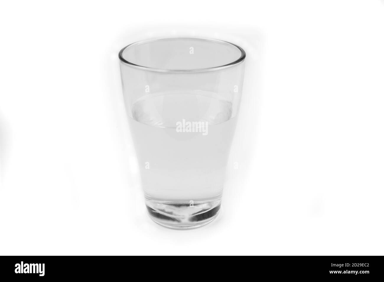 Glass fill with a water on a white Stock Photo - Alamy