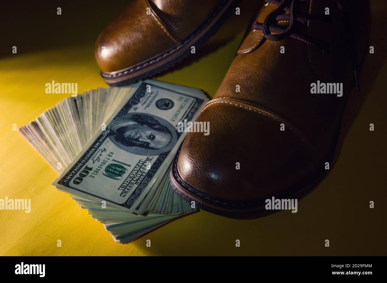 Concept photo of brown leather men's shoes, with dollars inside the ...