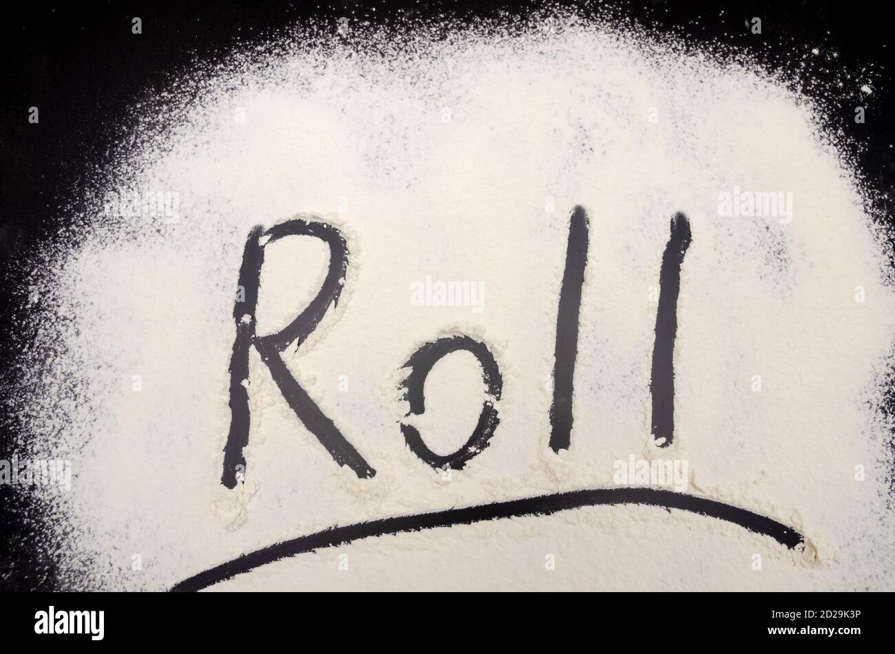 words Roll written on a black background with flour. Inscription Stock ...