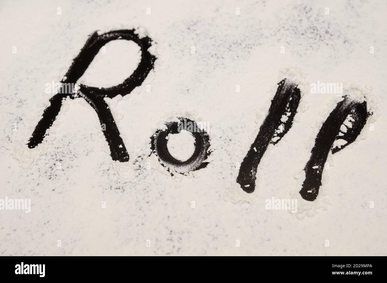 words Roll written on a black background with flour. Inscription Stock ...