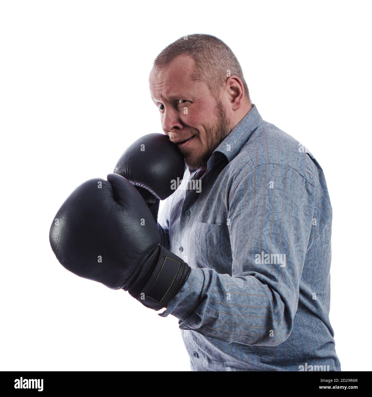 emotional actor man in a gray shirt with black boxing gloves on his ...