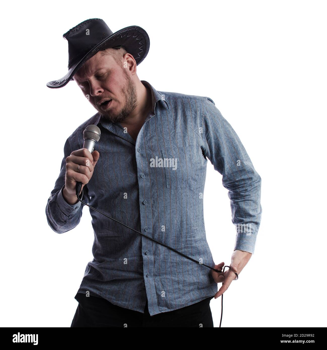 emotional actor man in a gray shirt and black hat with microphone in ...
