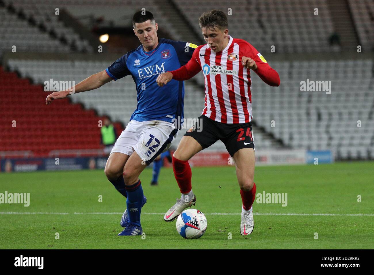 Jon mellish of carlisle united challenges daniel neill of sunderland hi ...