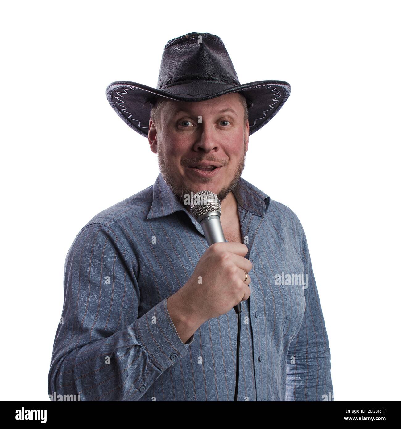emotional actor man in a gray shirt and black hat with microphone in ...