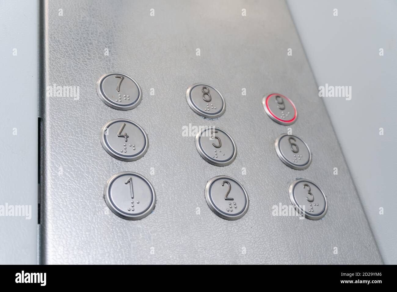 Elevator buttons with Braille, the system highlights the button for the ...