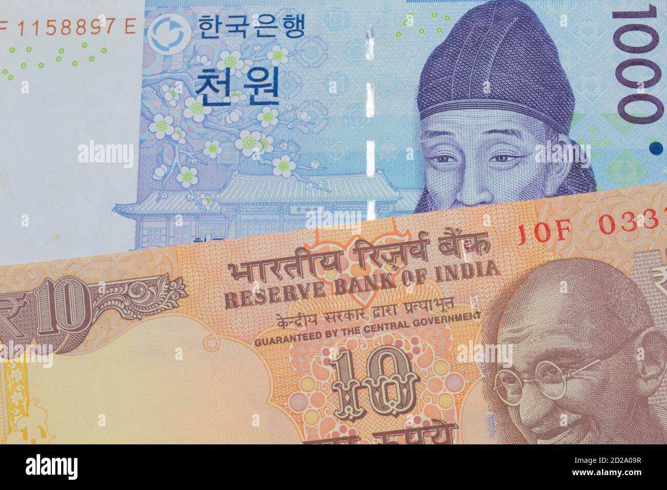 A Macro Image Of A Orange Ten Rupee Bill From India Paired Up With A a-macro-image-of-a-orange-ten-rupee-bill-from-india-paired-up-with-a