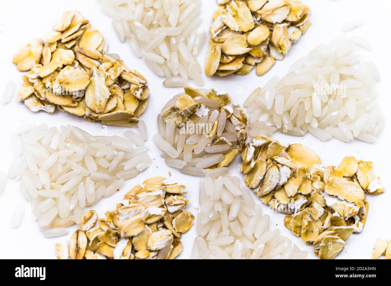 snowflake of rice and oatmeal, oatmeal and rice on a white background ...