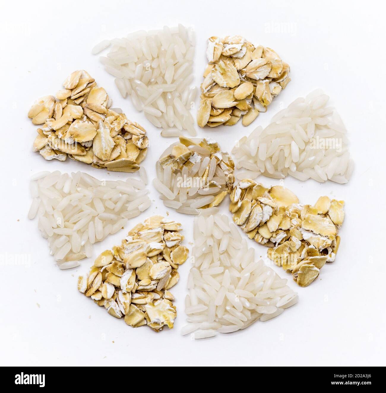 snowflake of rice and oatmeal, oatmeal and rice on a white background ...