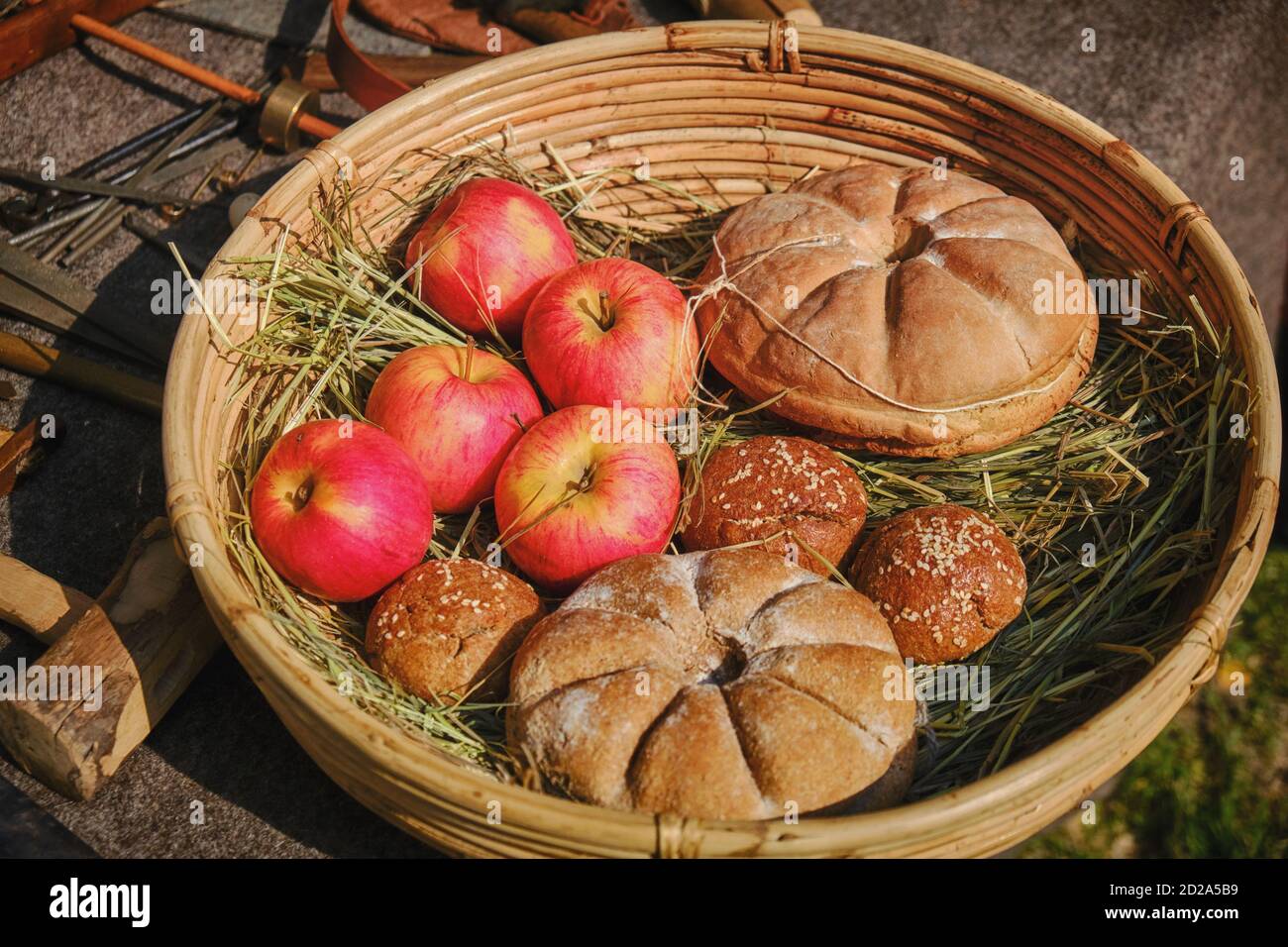 Bread baked on retro technology with apples in the basket ...