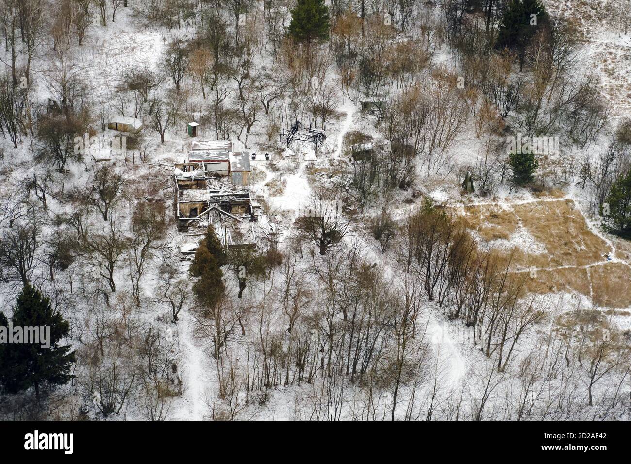 Destroyed burned house in the winter snow forest, top view Stock Photo ...
