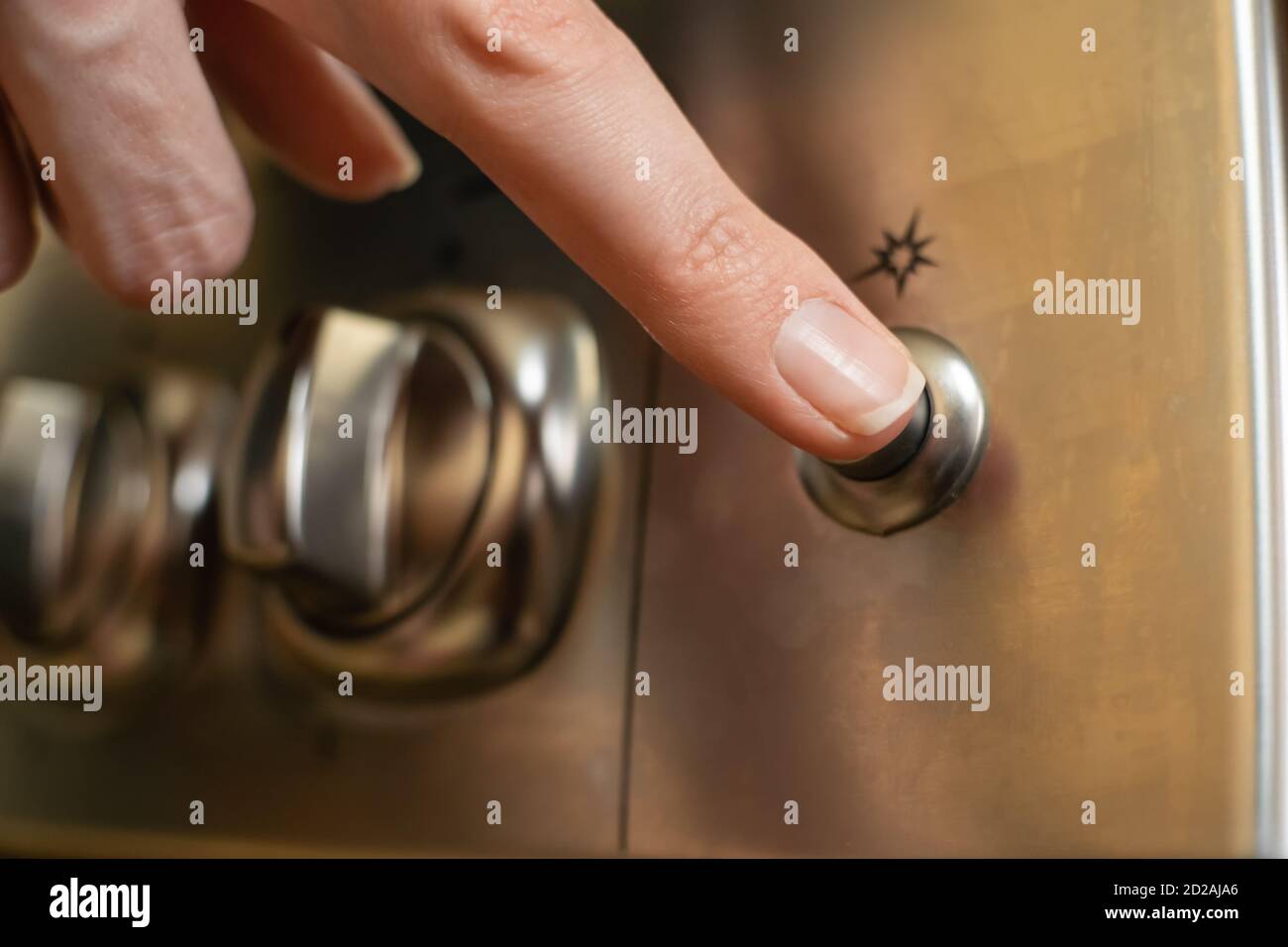 Womans hand light switch hi-res stock photography and images - Alamy