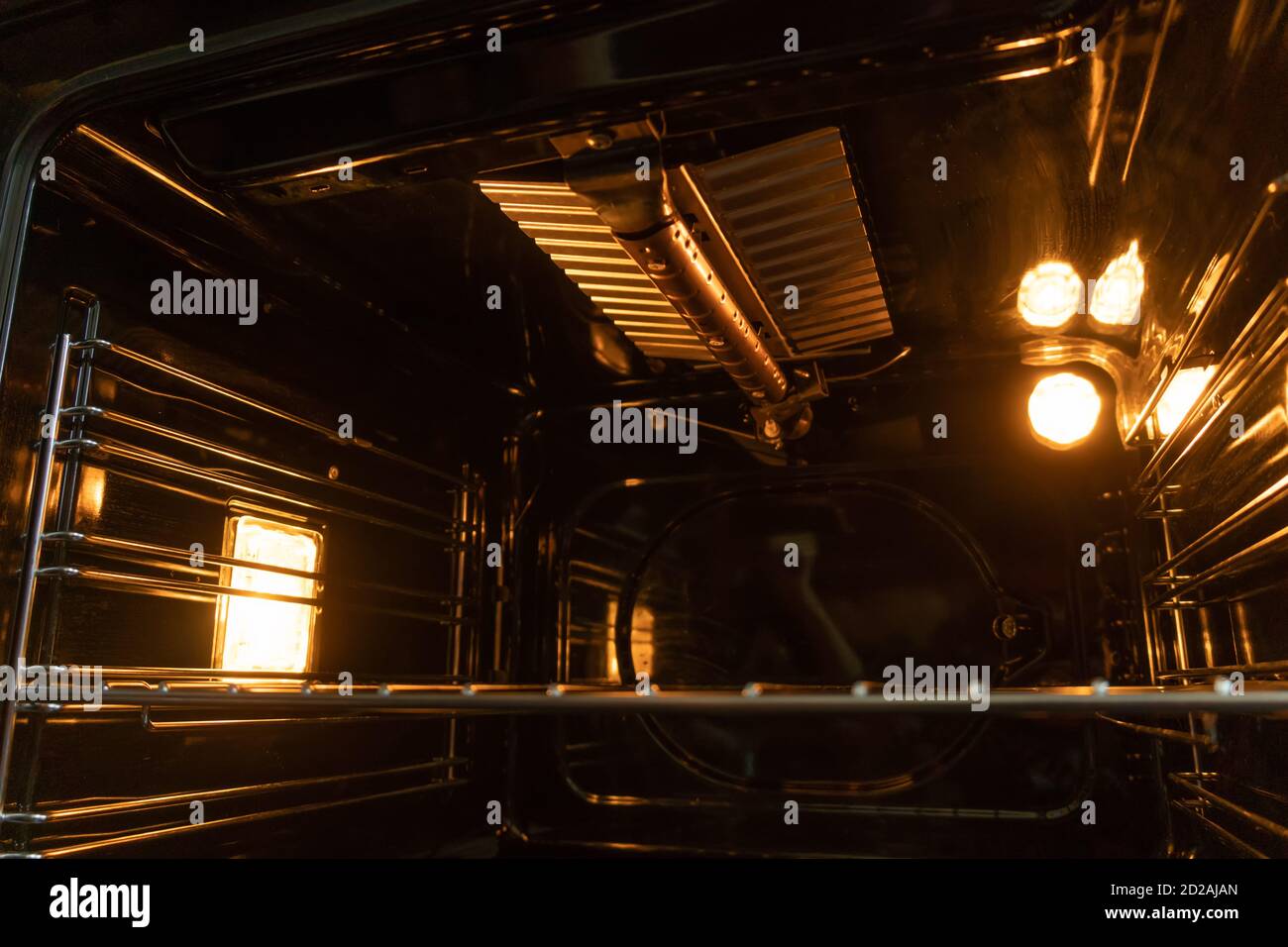 View inside the oven with the light on the stainless steel gas stove ...