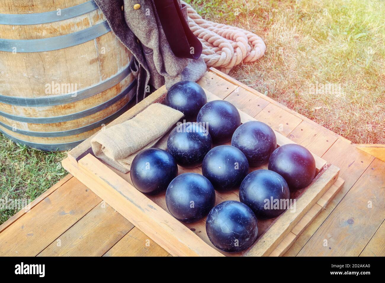 Retro shells lie near the barrel of gunpowder. Old cannonballs for the ...
