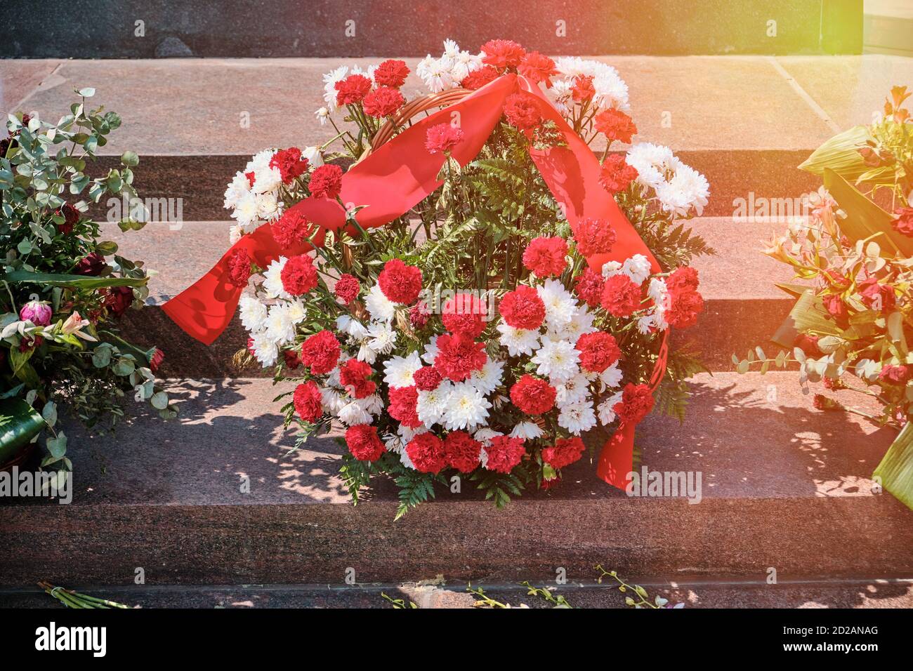 Funeral wreath of red and white carnations. Wreath of flowers at the ...