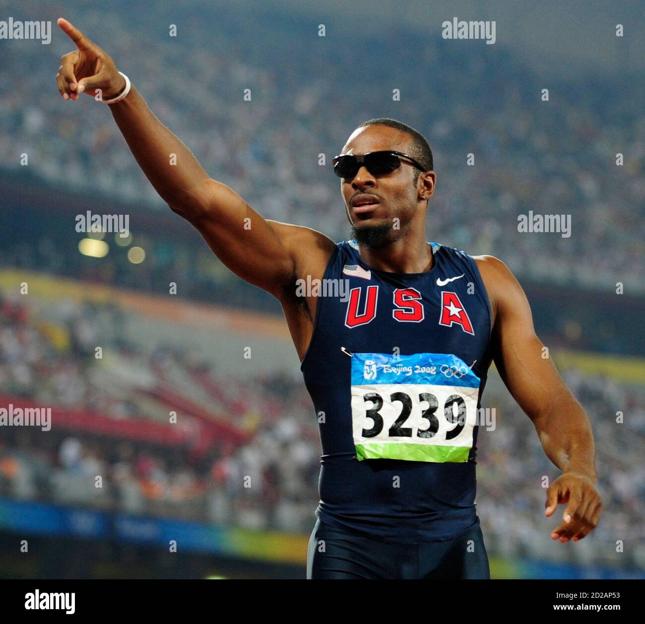 Angelo taylor celebrates winning the mens 400m hurdles hi-res stock ...