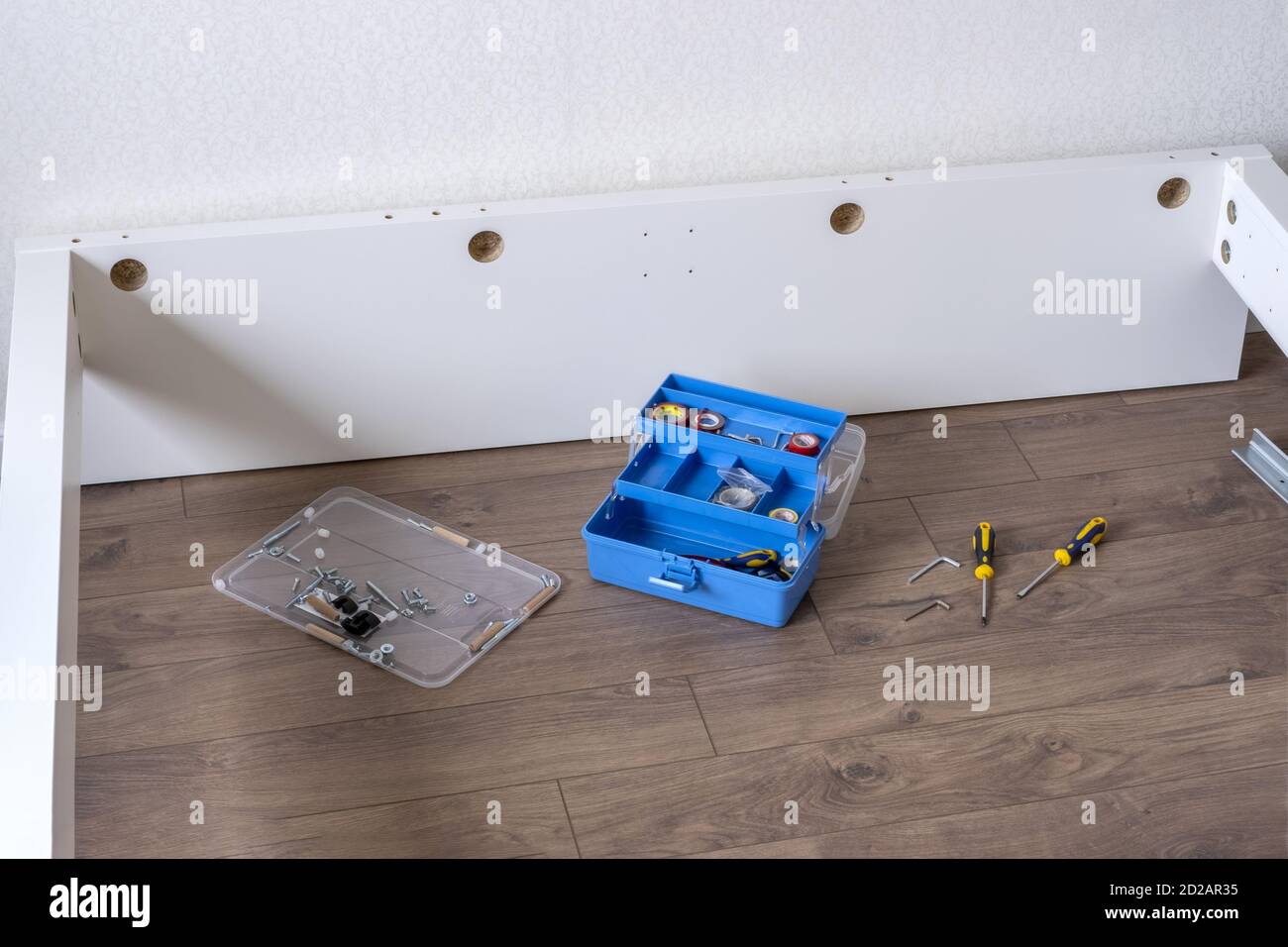 Tools for assembling the bed. Screwdrivers on the floor for furniture ...