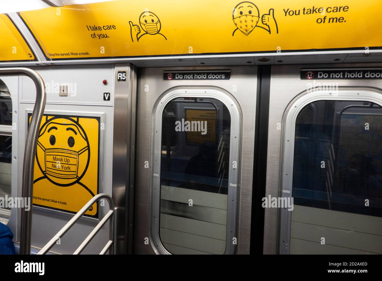 Wear a mask rule on NYC subway train Stock Photo - Alamy