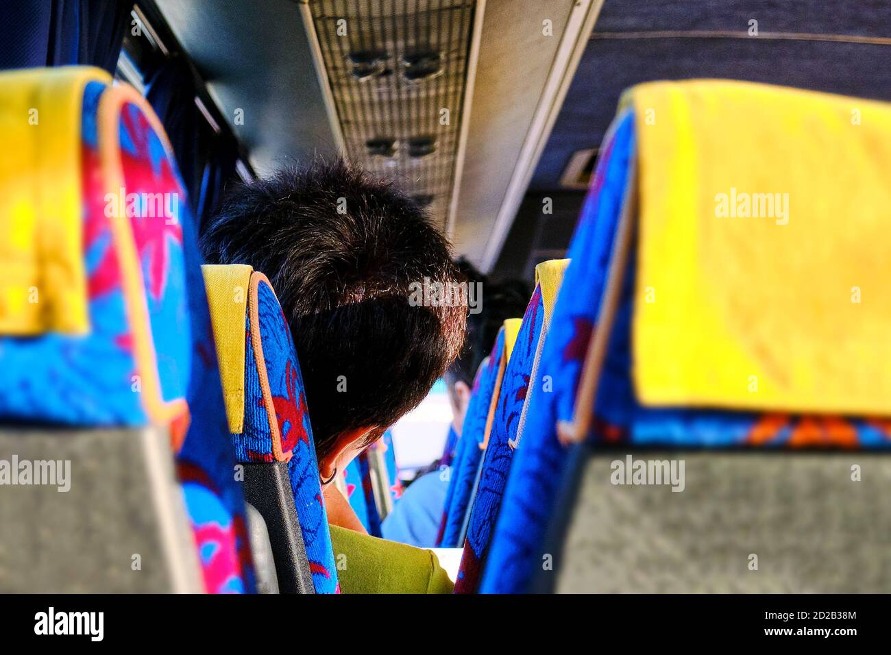 Woman on tourist bus in summer vacations. Modern city interior and ...