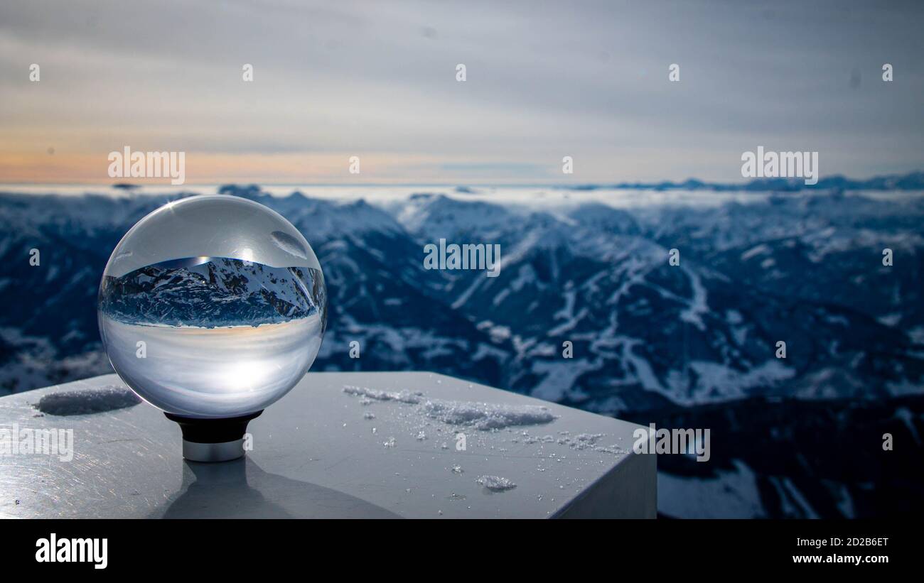 Alps in Austria through shown through a glass sphere Stock Photo - Alamy