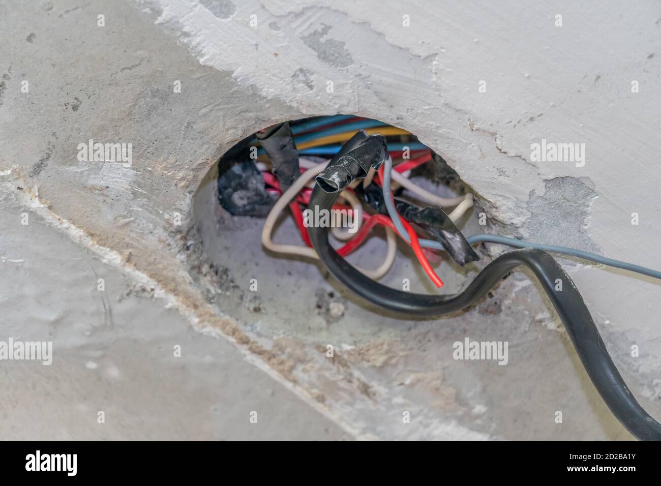 Wires from the outlet stick out of the wall, repair the outlet Stock ...