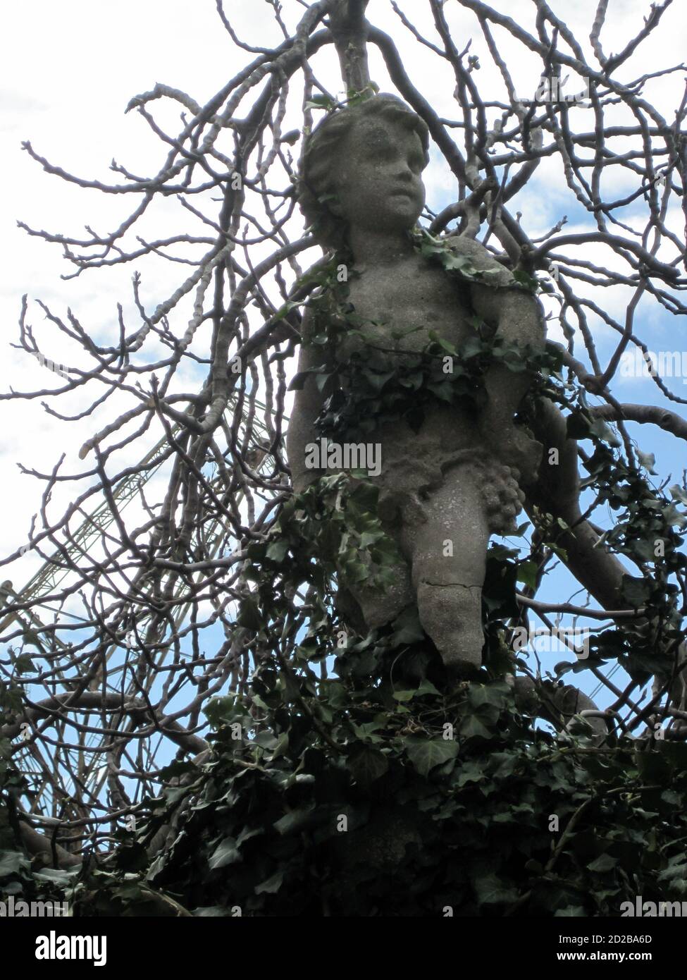 Statue with branches on a house gate in the City of Venice, Italy ...