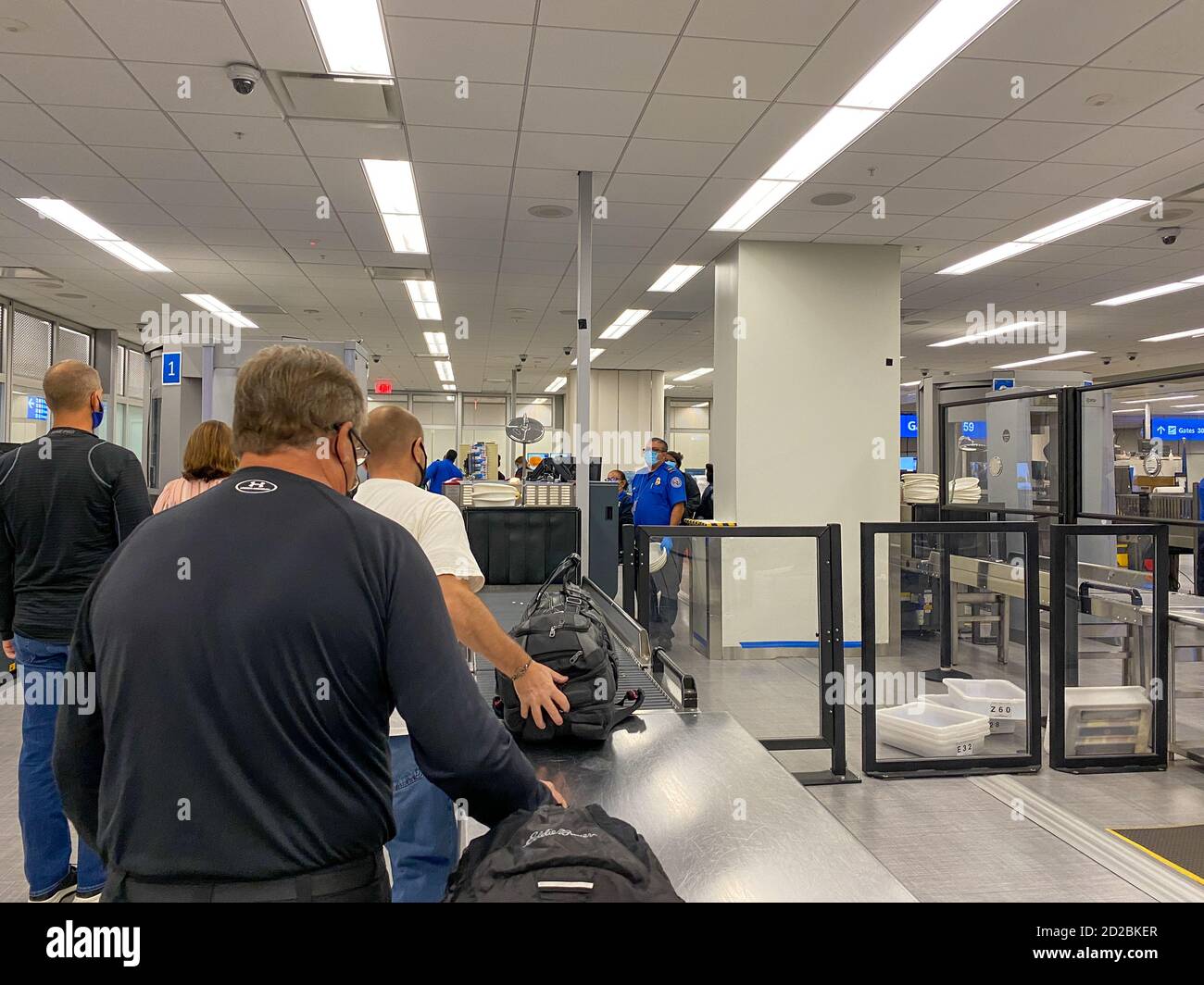 People going through security hi-res stock photography and images - Alamy