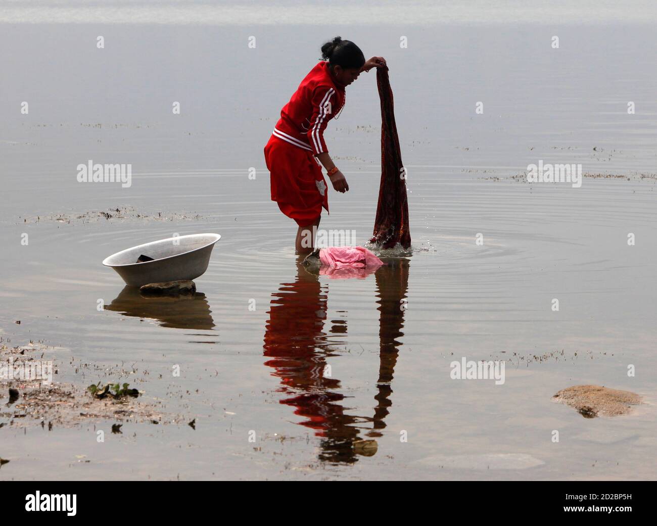 Nepal kathmandu woman washing clothes hi-res stock photography and ...
