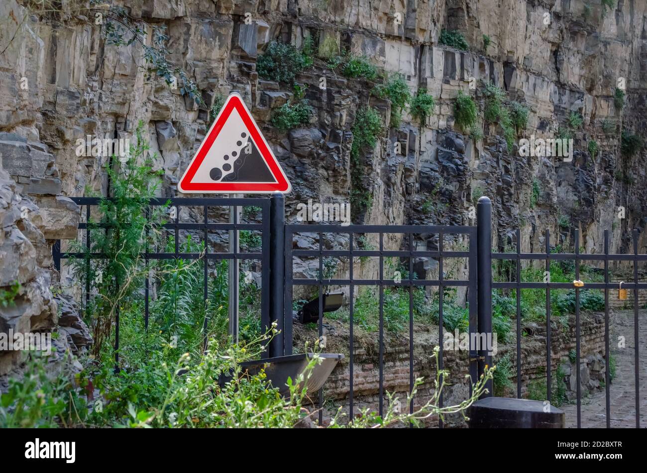 Close-up of a sign of possible rockfall from the mountains, warning of ...