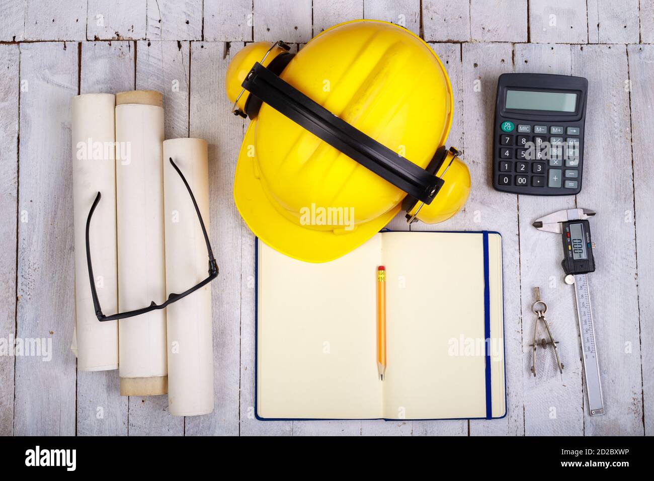 View of the construction engineer desk. Notebook, caliper and other ...