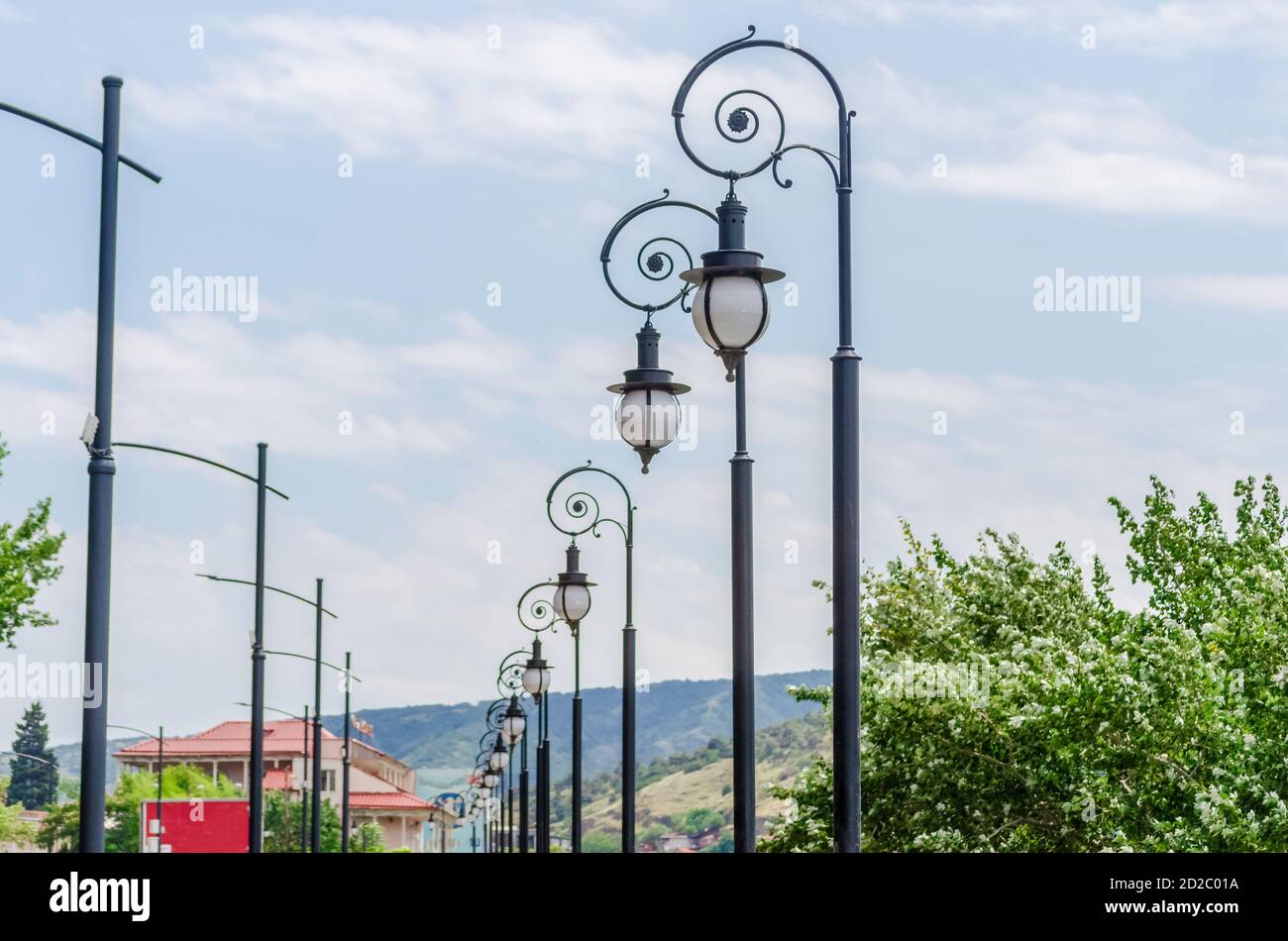 beautiful street lights, standing in a row and creating a rhythm ...