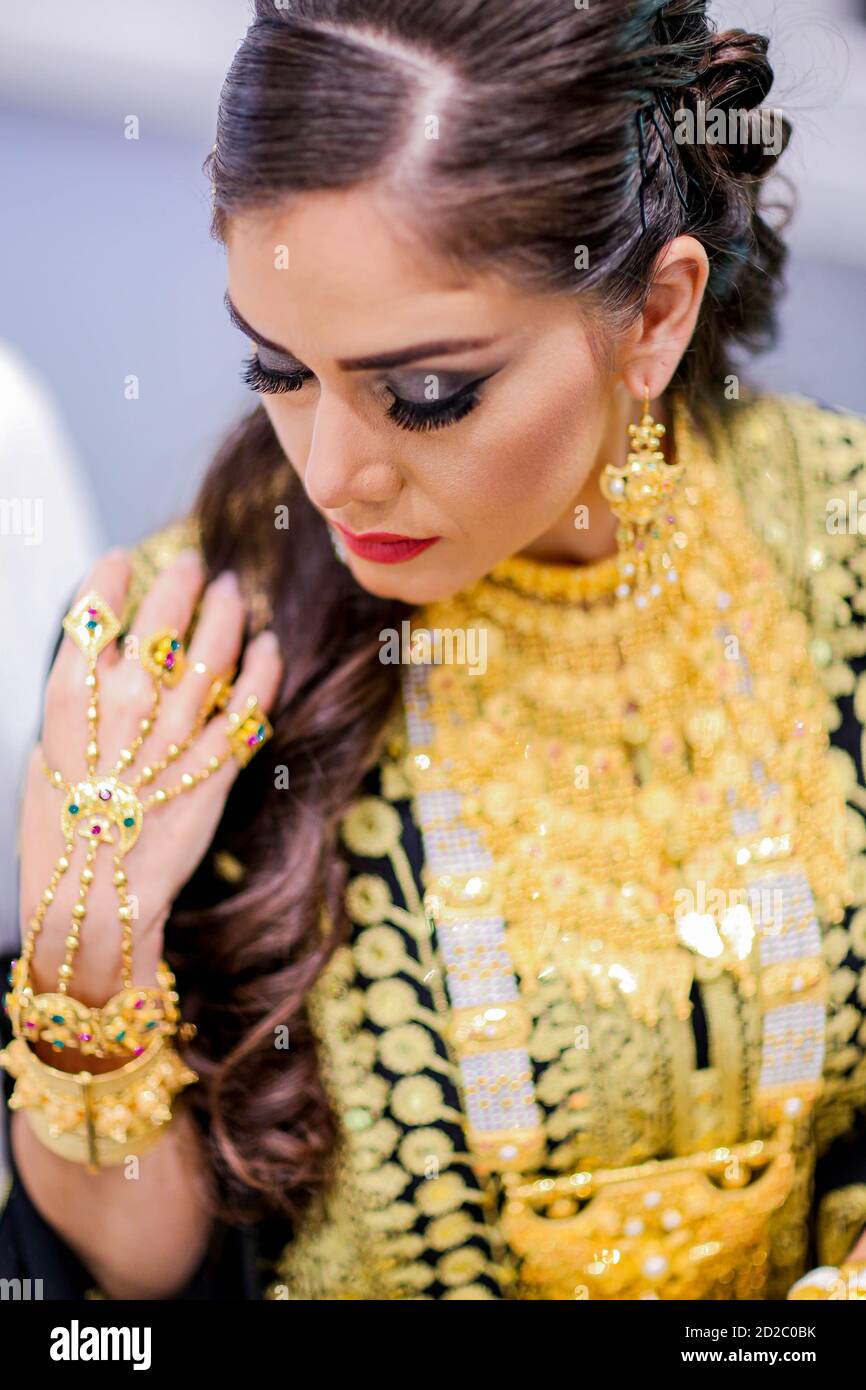 Arab Female in traditional dress with traditional jewelry Stock Photo ...