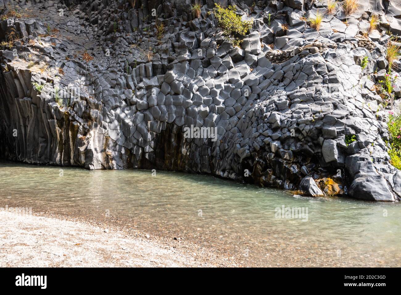 Basalt rocks and pristine water of Alcantara gorges in Sicily, Italy ...