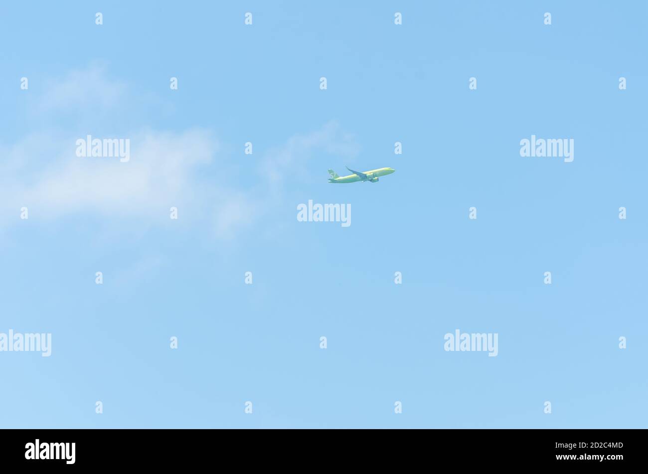 light green plane flies without leaving a trace on the background of ...