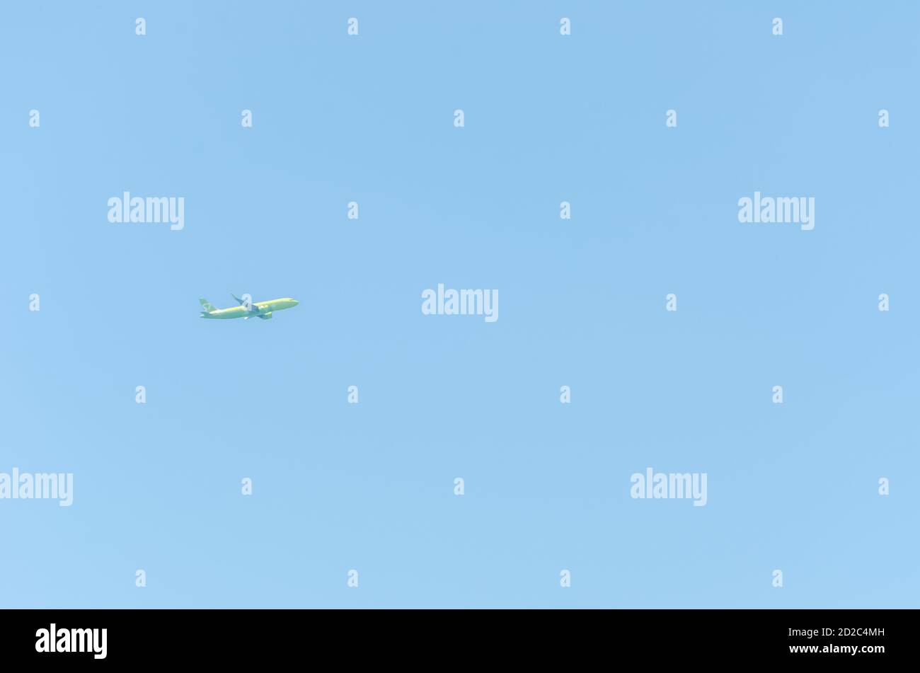 light green plane flies without leaving a trace on the background of ...