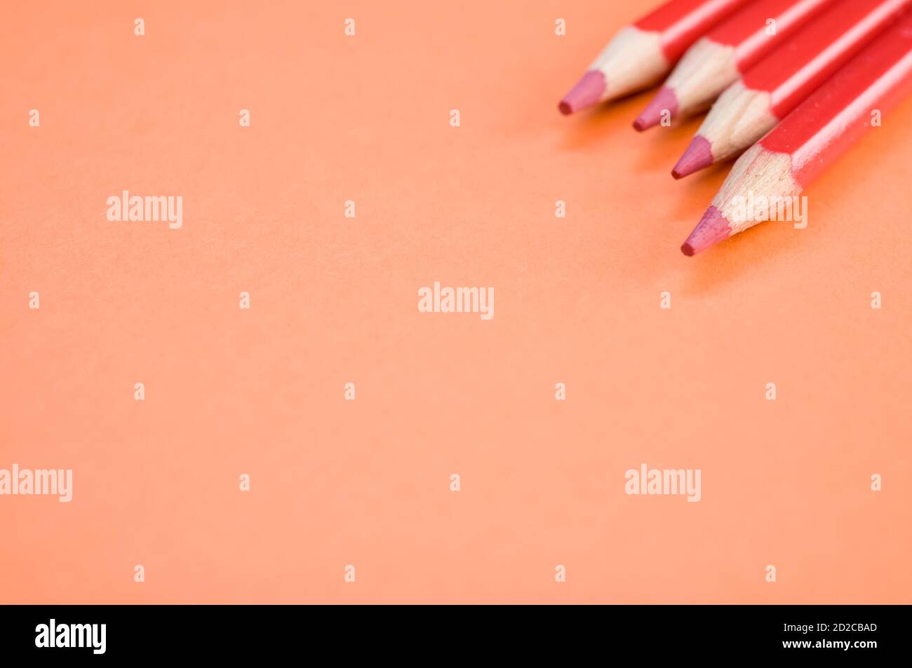 High angle shot of red pencils on a red surface Stock Photo - Alamy