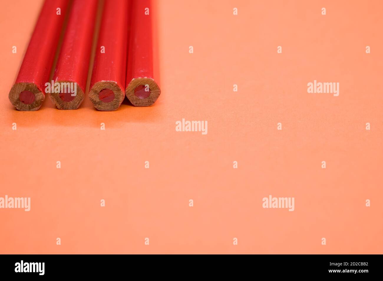 High angle shot of red pencils on a red surface Stock Photo - Alamy