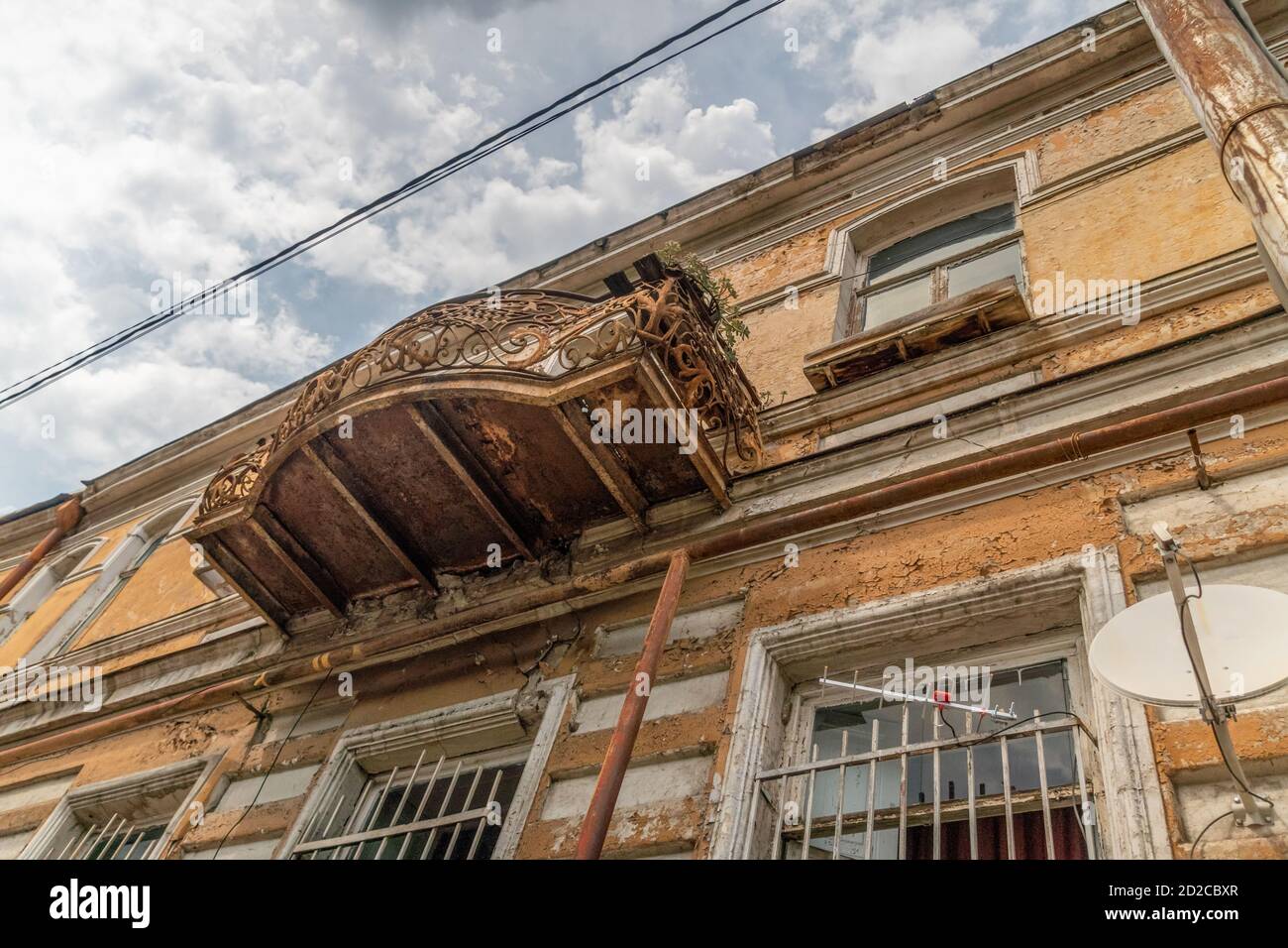 old balcony on an old house against the sky, bottom-up photo Stock ...